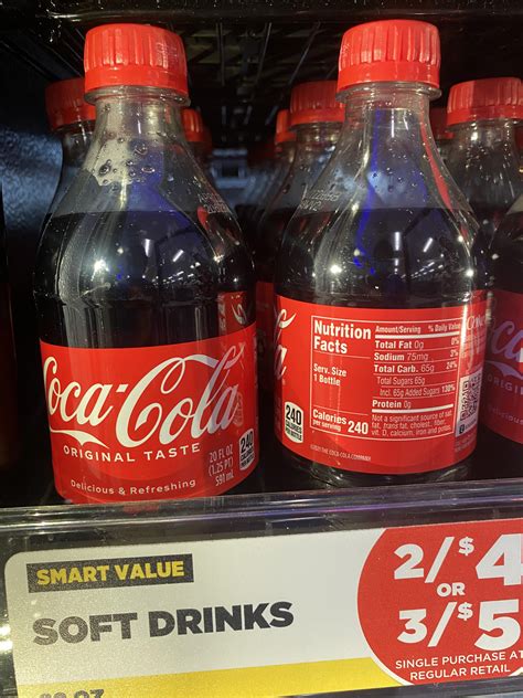 The Coke Bottle S Wrapper Is Slightly Lower Than The One On The Right