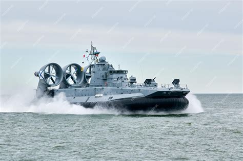 Premium Photo Hovercraft Warship Armed With Armament Sails Into Sea