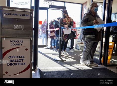 Residents Stand In Line To Vote Early At The Douglas County Election