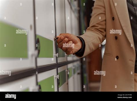 Close Up Of Businessman Put His Personal Things To Storage Cells Before
