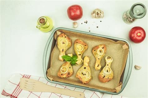 Premium Photo Fresh Chicken Legs In Spices On A Baking Sheet