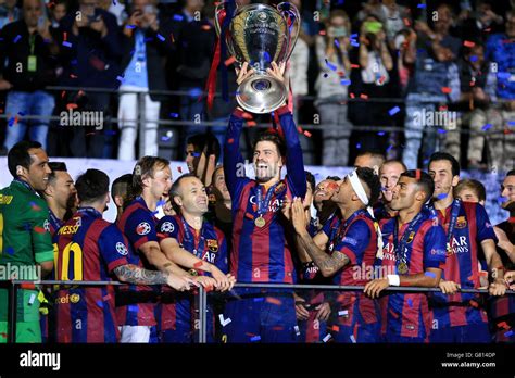 Barcelonas Gerard Pique Celebrates With The Trophy Hi Res Stock