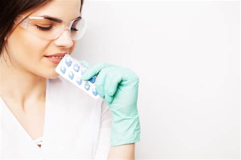 Premium Photo Sexual Health A Doctor In A White Coat Holding A Pill For A Healthy Sex Life Of