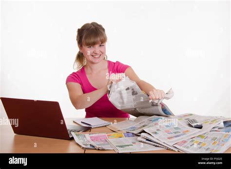 The Girl At The Table With Pleasure Tearing Paper Stock Photo Alamy