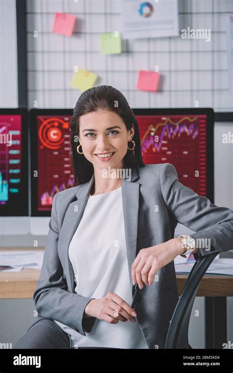 Beautiful Data Analyst Smiling At Camera With Working In Office Stock