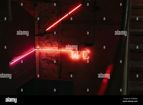 A Night Bar Interior Design With Red Neon Lights With WC Sign Stock Photo Alamy