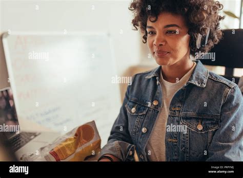 Portrait Of African Woman Working On Computer Female Computer Programmer Working At Tech
