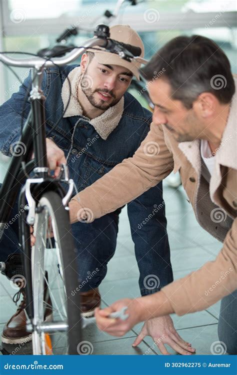 Man Fixing Bicycle Wheel With Spanner Stock Image Image Of Worker Repair 302962275