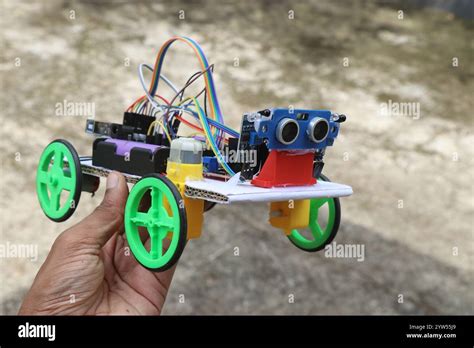 Robotic Car Built At Home Using Programmable Controller That Follows Human Held In The Hand That