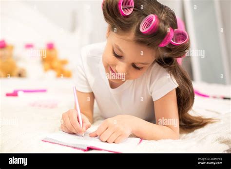 Girl Writing In Her Notebook In Bed Stock Photo Alamy