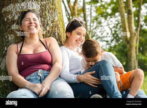 Couple Of Young Women Laughing Out Loud While Talking And Spending