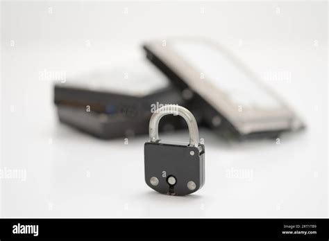 Computer Hard Disks And Metal Padlock Symbolizing Concept For Encrypted