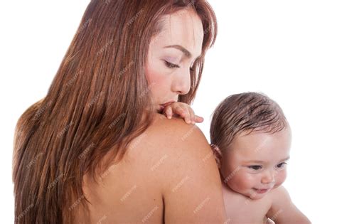 Premium Photo Shirtless Mother Kissing Naked Daughter Hand Against
