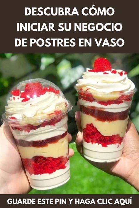 Two Desserts In Plastic Cups With Red And White Frosting On Them One Being Held Up By Someone S