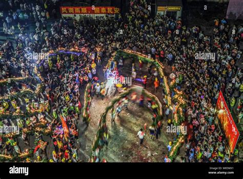 Chinese Entertainers Perform A Fire Dragon Dance To Celebrate The Mid