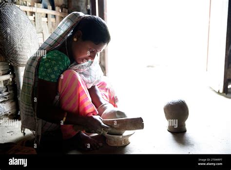 Woman In Traditional Indian Clothes Making Pottery In His Wooden House In A Small Village On