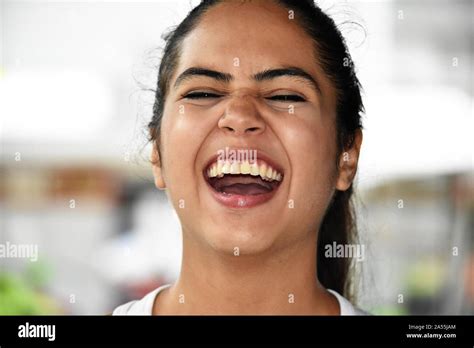 Cute Colombian Teenage Female Laughing Stock Photo Alamy