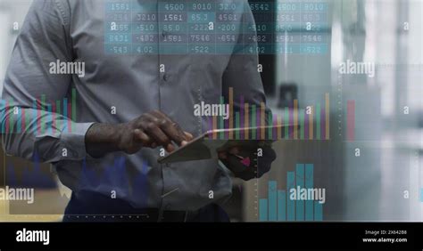 Image Of Graphs And Number Charts Senior African American Man