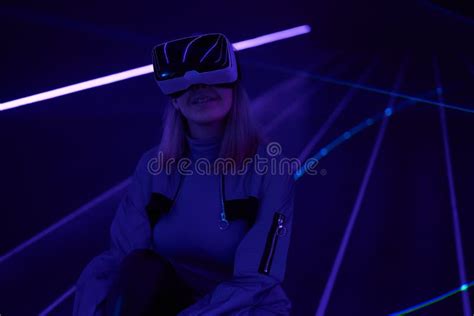 Woman Is Using Virtual Reality Headset To Access In Metaverse Stock