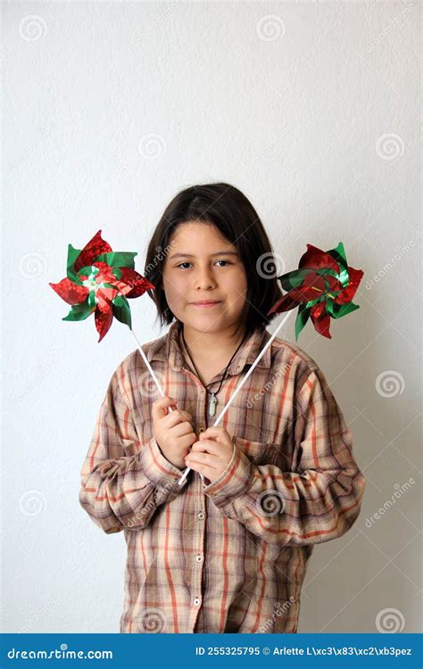 Year Old Latina Hispanic Girl Plays With Green White And Red Pennant Flags And Pinwheel To