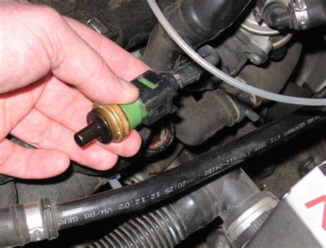 How To Replace The Coolant Housing And Temp Sensor On A 2003 Volkswagen