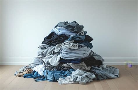 Premium Photo Clothes Pile On Wooden Floor