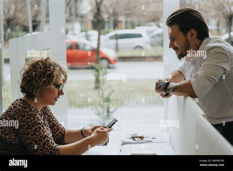 Successful Multi Generational Team Discussing Innovative Business Strategies In The Office Stock