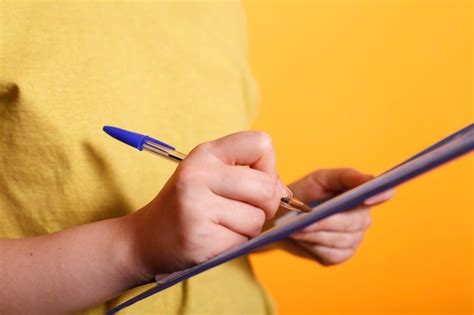 Free Photo Person Making Notes On A Notepad