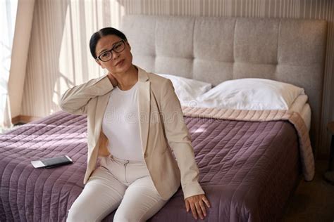 Businesswoman Suffering From Cervicalgia Upon Arrival In Hotel Room