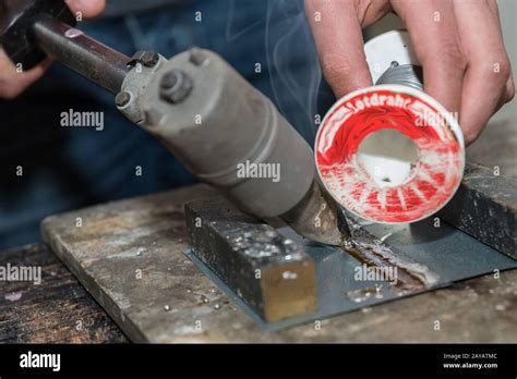 Manual Worker Learns To Solder With Soldering Iron And Solder Wire Close Up Stock Photo Alamy