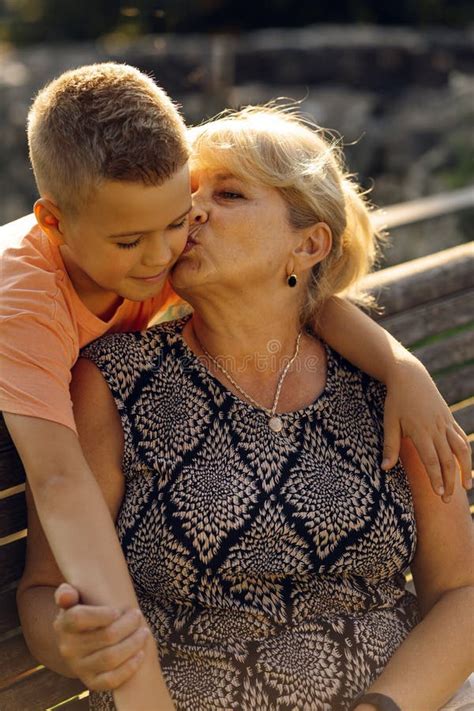 Happy Grandmother With Grandson Together Grandmother Kisses Her