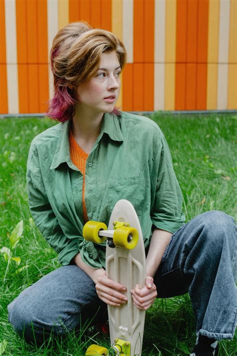 Active Sporty Teen Skater Girl With Plastic Skateboard Outdoors Stock