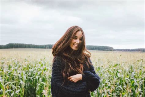 Beautiful Carefree Long Hair Asian Girl In Knitted Sweater In Autumn