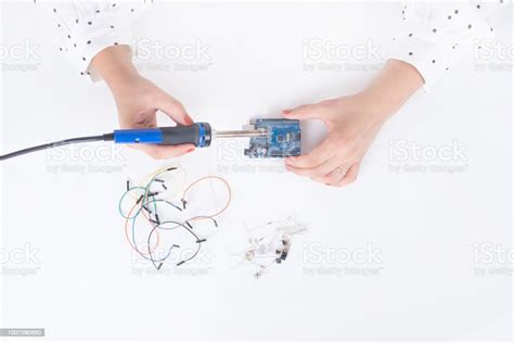Young Woman Engineer Working On Opensource Hardware And Software