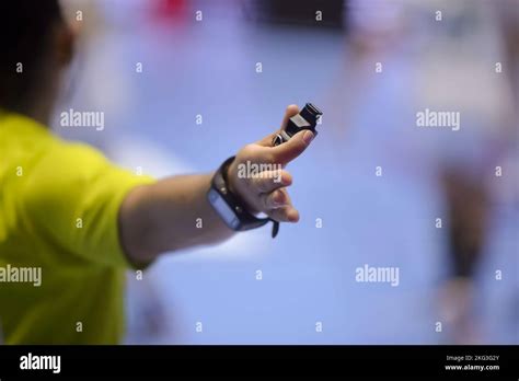 Shallow Depth Of Field With Handball Referee Hand Holding A Whistle