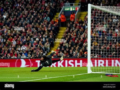 Liverpool Goalkeeper Alisson Becker Makes A Save During The Champions