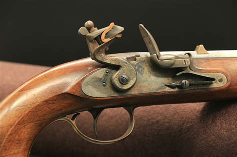 Closeup Of The Trigger And Flintlock With The Mounted Flint And Closed