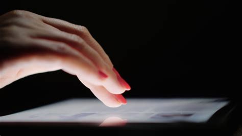 Internet Browsing On The Tablet Female Fingers Scroll Text Screen