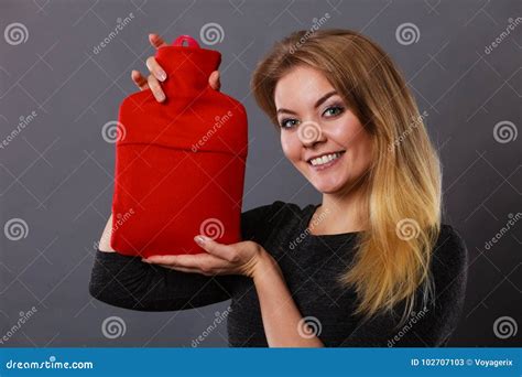 Woman Holding Warm Red Hot Water Bottle Stock Image Image Of Holding