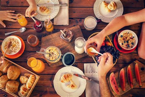 People Eating Breakfast On The Go