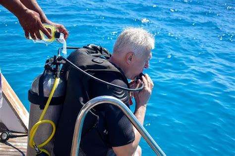 Premium Photo Scuba Diver Before Diving Male In Scuba Diving Suit Is Preparing To Dive Into