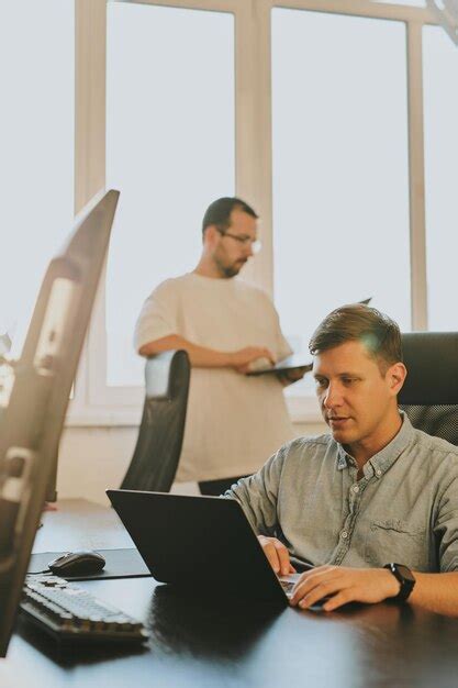 Premium Photo Portrait Of Two Professional Male Programmers Working On Computer In Diverse