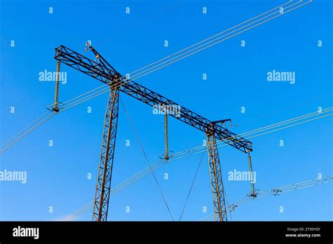 Power Line Support With Wires Against A Blue Sky Electricity Line
