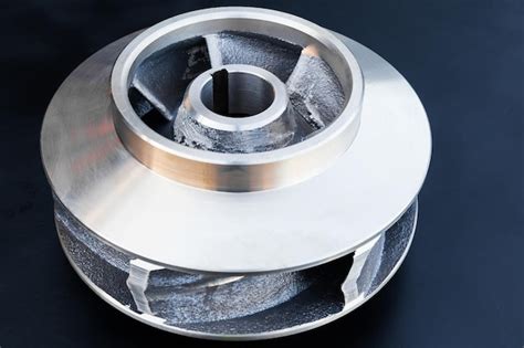Premium Photo New Bronze Impeller On A Dark Blue Background Top View