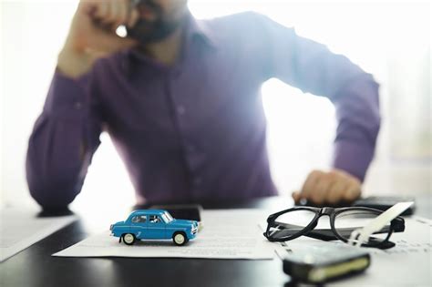 Premium Photo The Insurance Agent Signs A Document Car Insurance