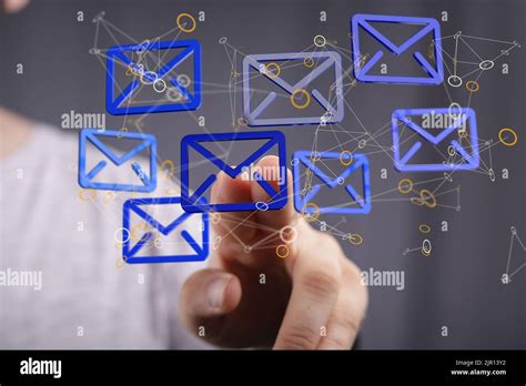 A Man Tapping A Floating 3D Rendered Email Icons Stock Photo Alamy