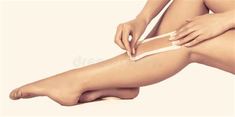 Waxing Woman Leg With Wax Strip At Beauty Spa Close Up Waxing Woman