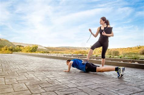 Girl Coach Training Hard A Man Through Push Ups Stock Image Image Of
