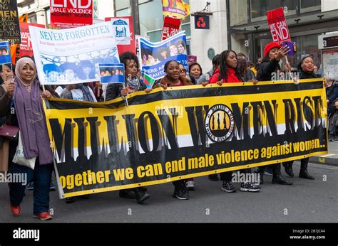 Female Protesters With Banners At The Million Women Rise Demonstration