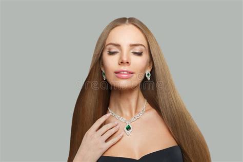 Glorious Glamorous Woman With Brown Hair Makeup And Gold Jewelry